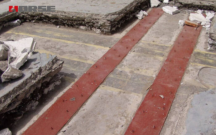 Bonding steel plate and CFRP to concrete for beam, slab strengthening